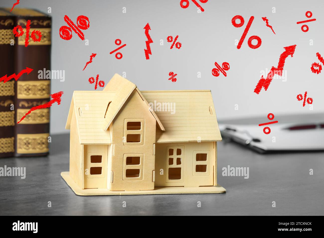 Mortgage rate rising illustrated by upward arrows and percent signs ...