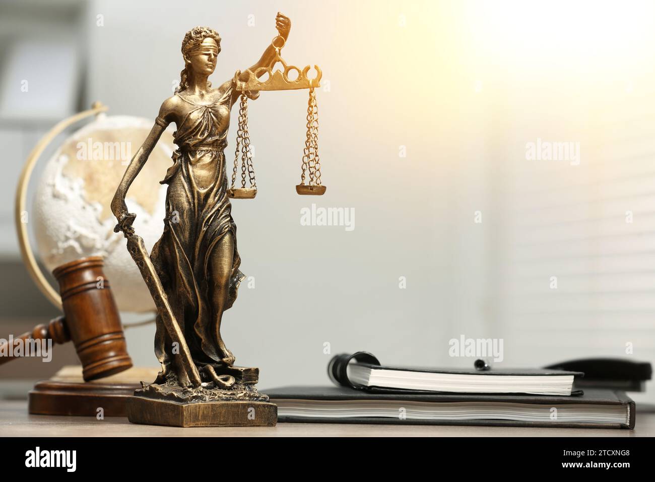 Symbol of fair treatment under law. Statue of Lady Justice, gavel and ...