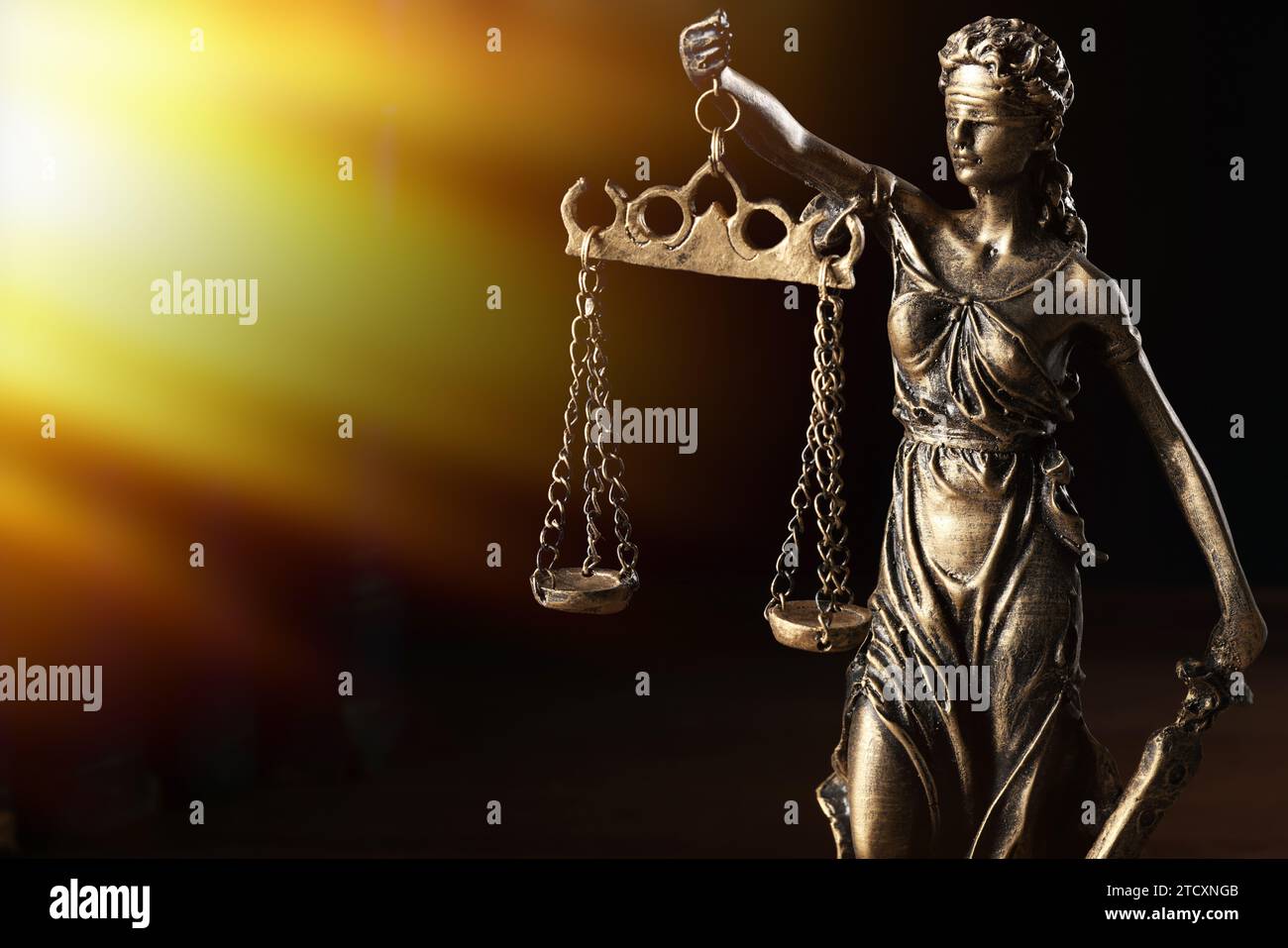 Symbol of fair treatment under law. Statue of Lady Justice on dark ...