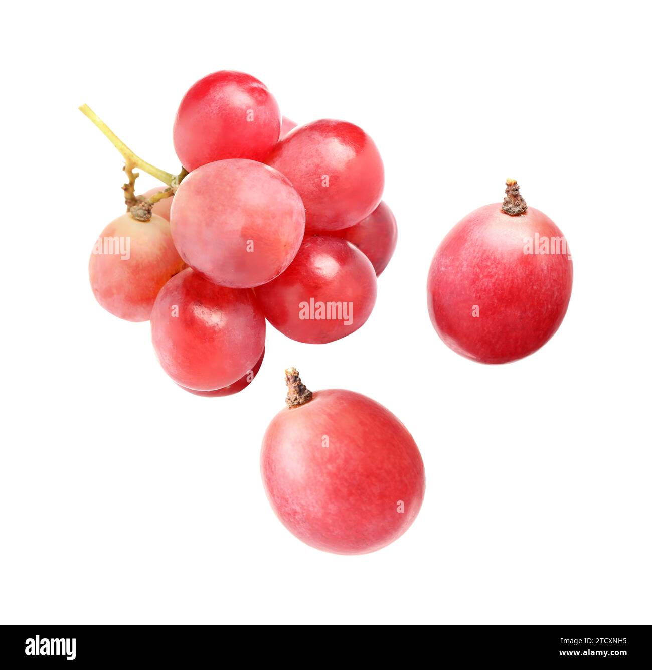 Many fresh grapes falling on white background Stock Photo - Alamy