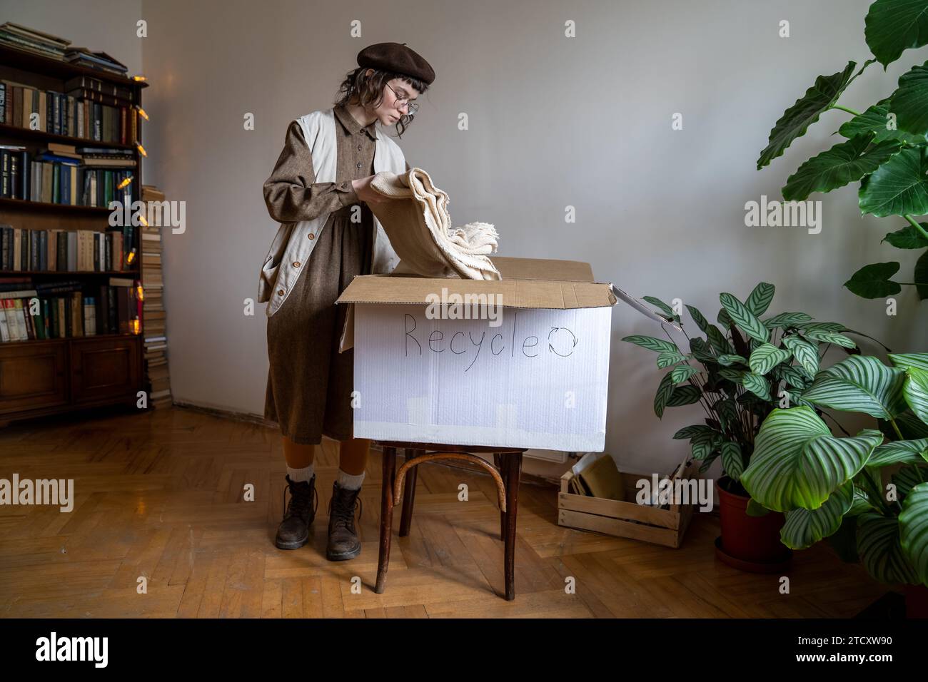 Girl living eco friendly lifestyle collecting things clothes for ...