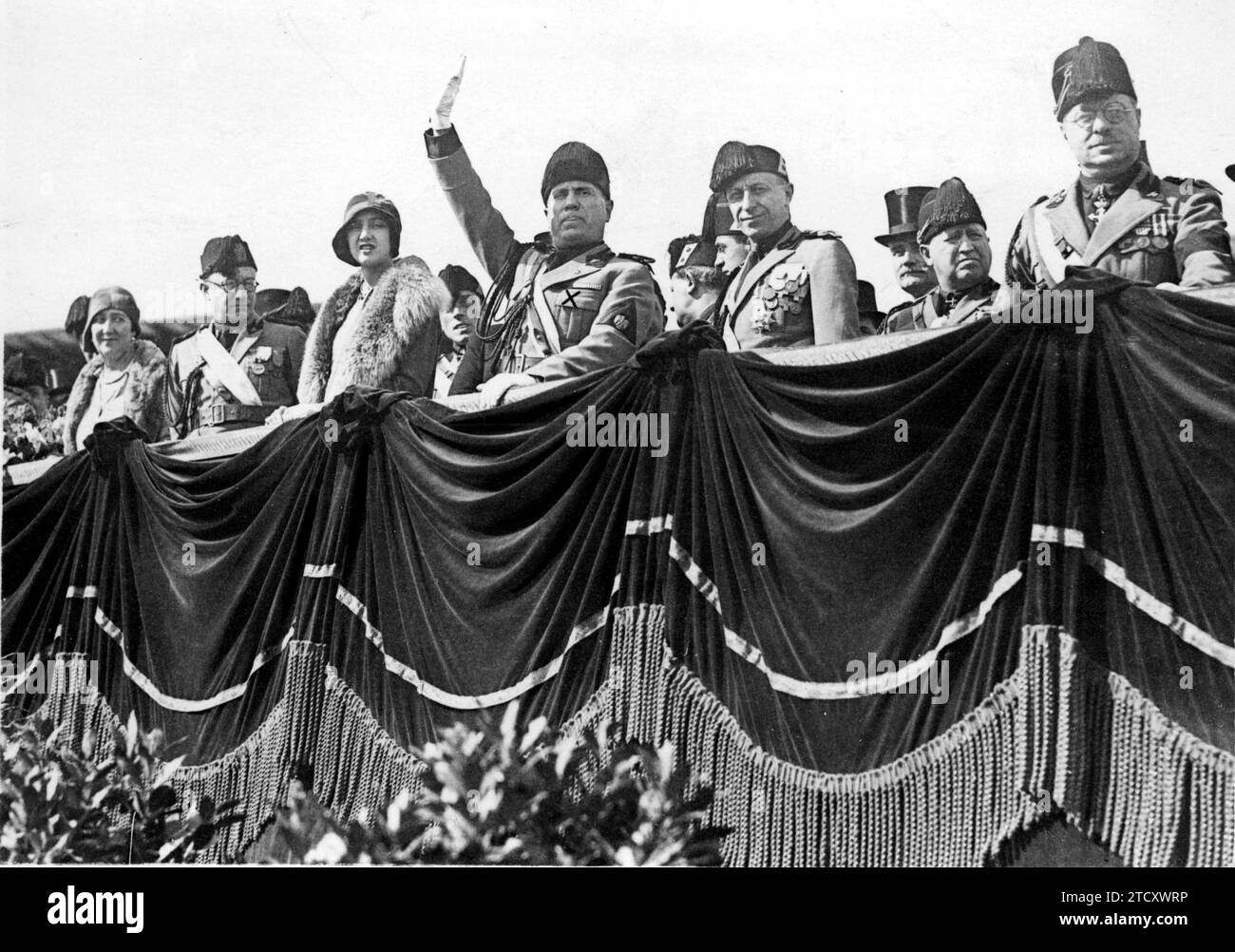 10/31/1928. Benito Mussolini greets A la Romana while reviewing the ...
