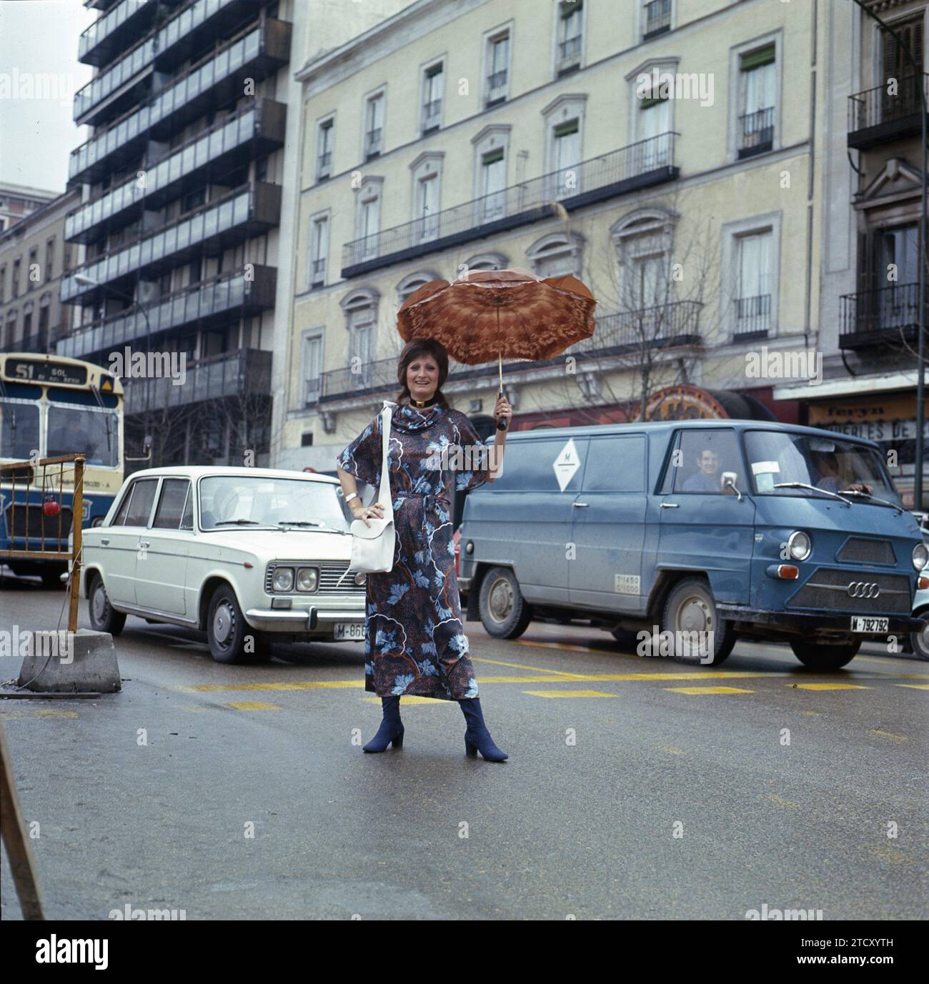 Madrid, 1981.- A model poses on Serrano Street with a dress and an ...