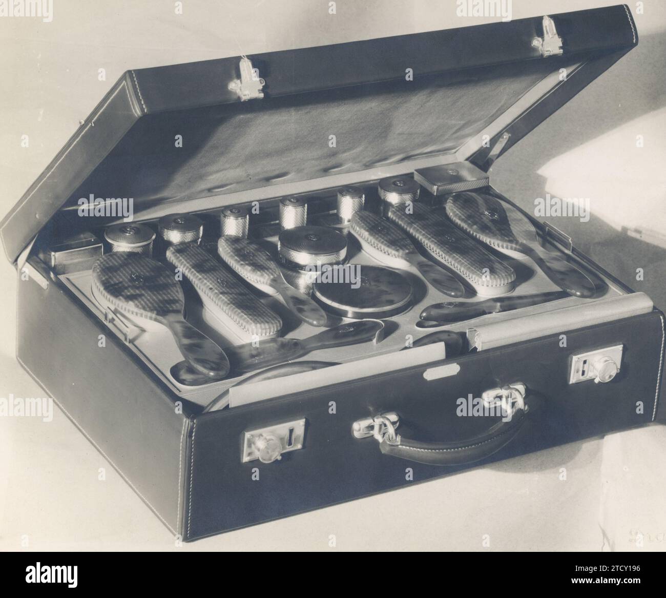 12/31/1927. In the Image, red leather suitcase with beige suede lining ...