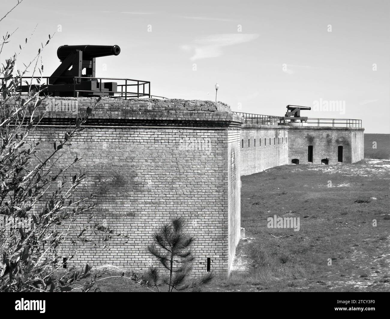 Monochrome of two civil war cannons in a defensive position at Fort ...