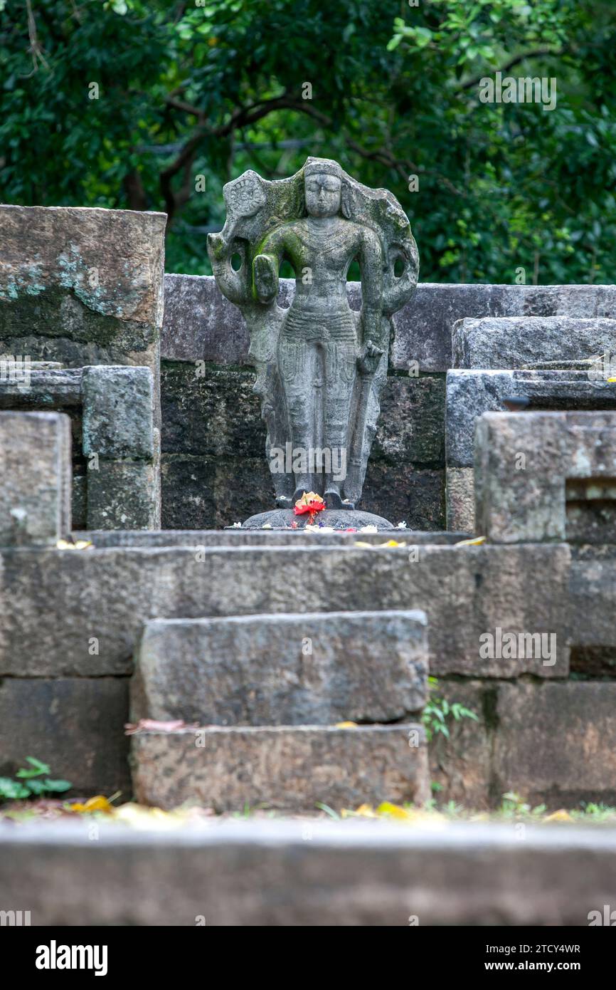 A stone statue of Vishnu within the ruins of the Hindu Vishnu Devale No ...
