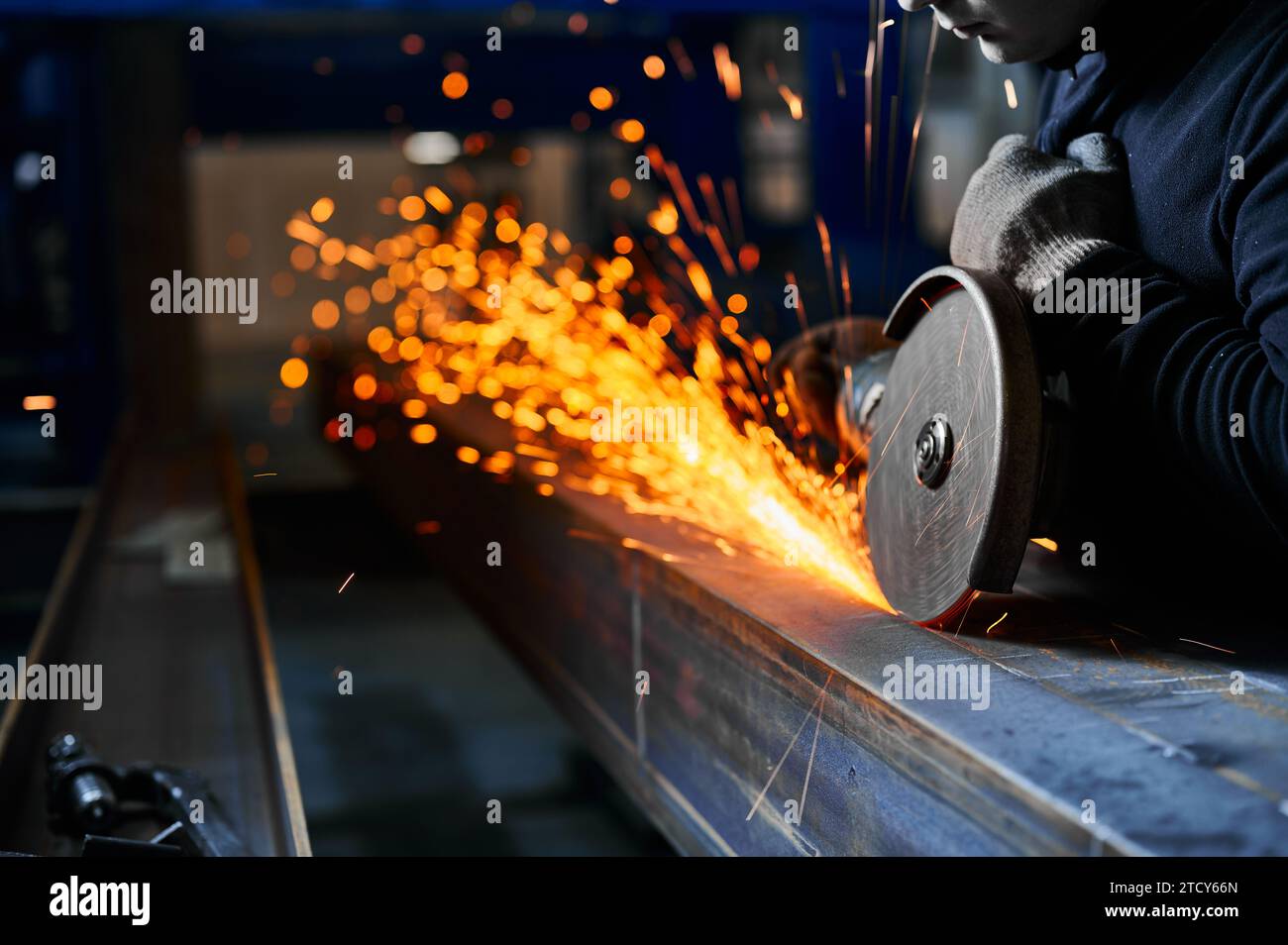 Cutting of metal beam with abrasive tool at metalwork plant Stock Photo ...