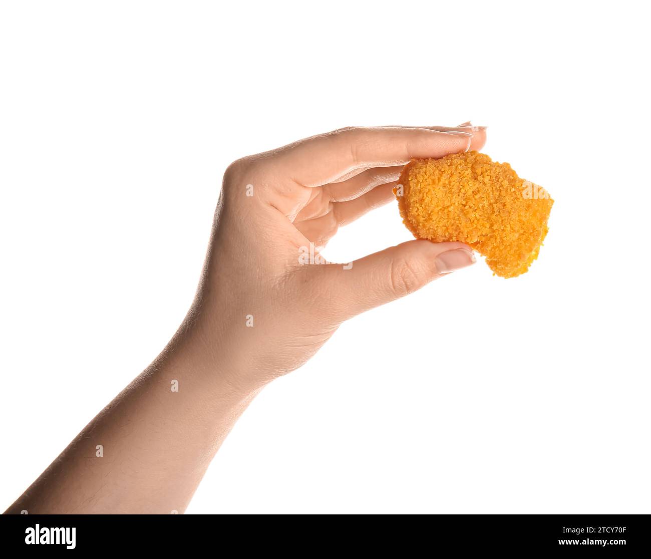 Female hand with tasty nugget on white background Stock Photo - Alamy