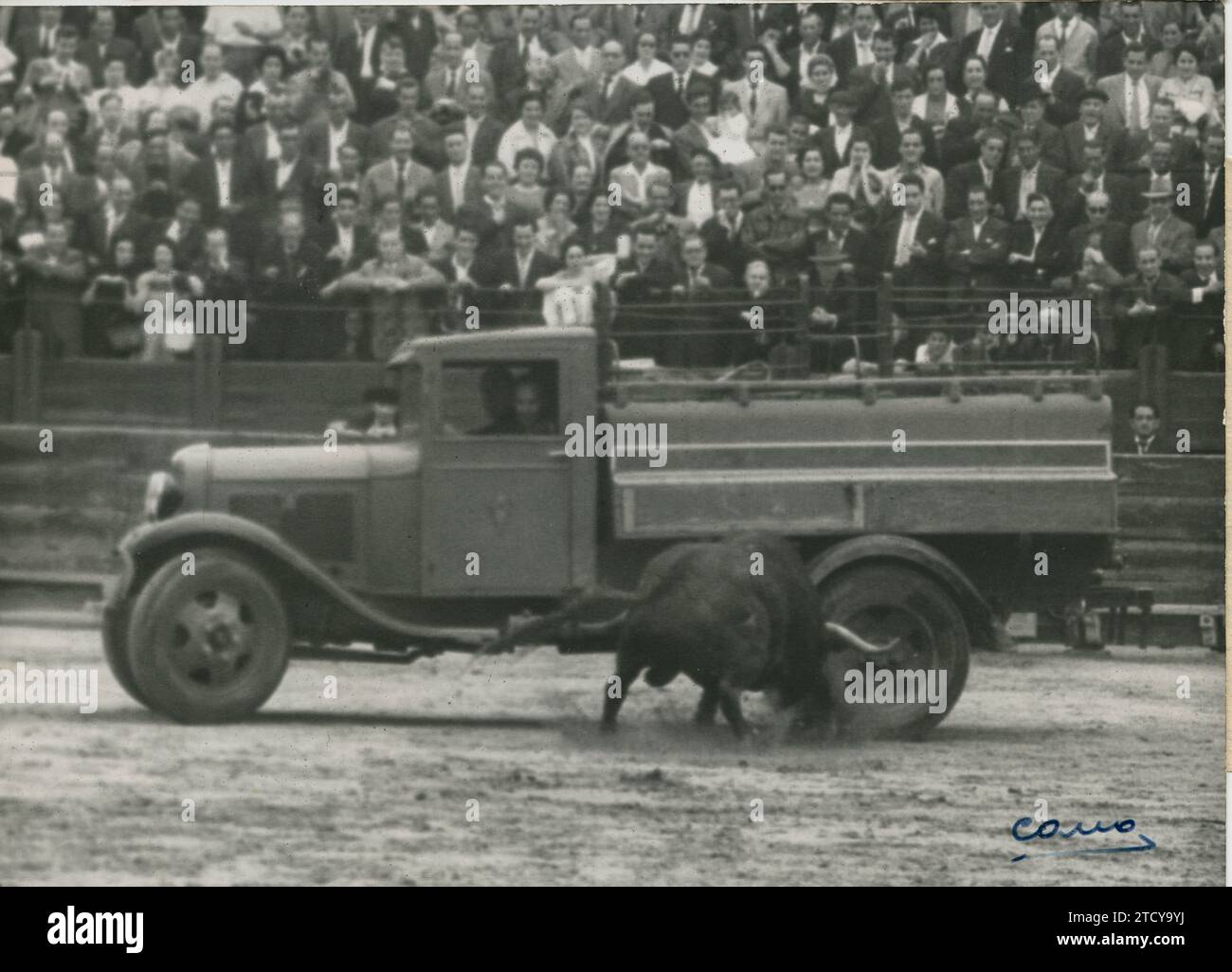 Toledo, 06/05/1958. Corpus bullfight. An irrigation truck helps take ...