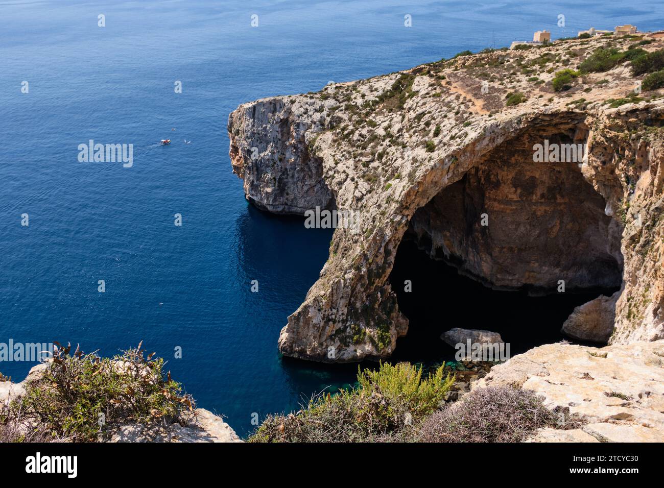 The natural arch of the Blue Grotto photographed from the Blue Wall and ...