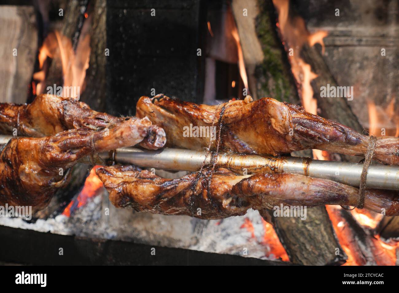 Grilled roasted mutton meat on spit at street food market Stock Photo ...