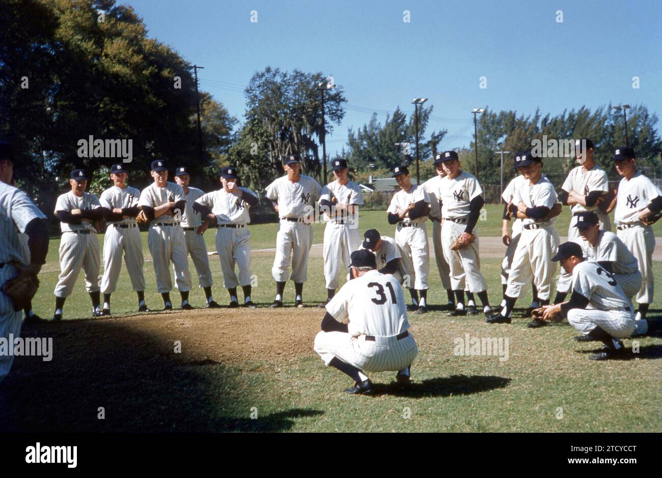 ST. PETERSBURG, FL - FEBRUARY, 1955: The New York Yankees listen to a ...