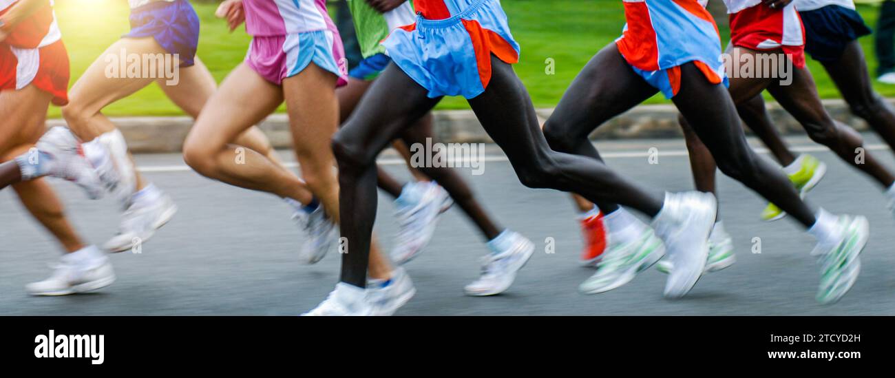 Side view of athletes running in a cross country race Stock Photo - Alamy