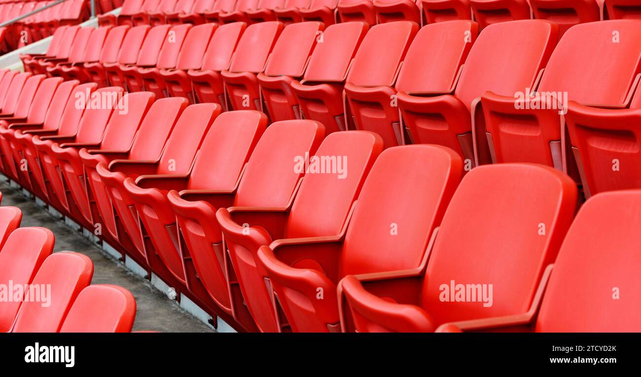 Rows of red seats in a stadium Stock Photo - Alamy
