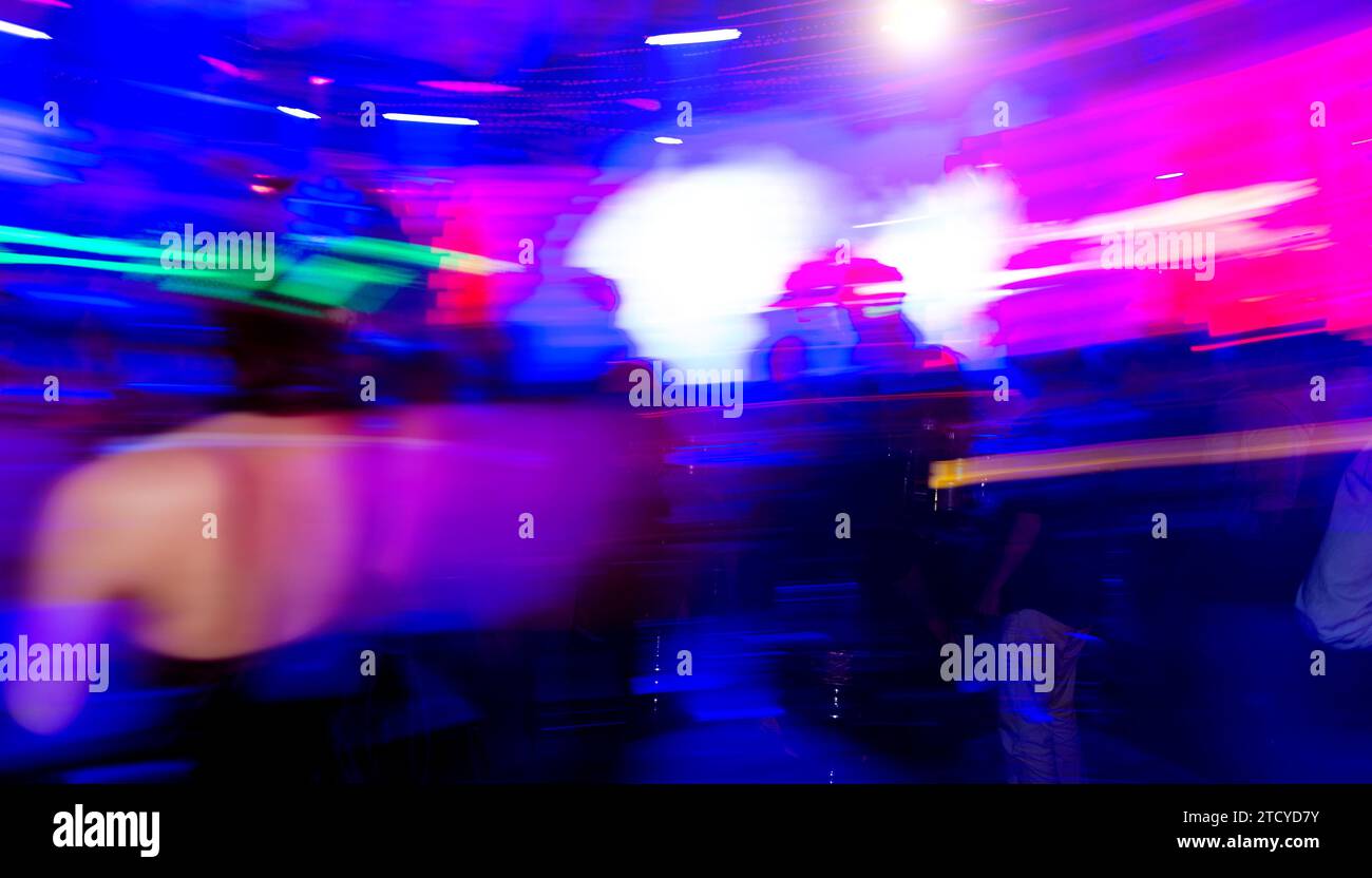 Abstract dancing people motion blur effect in nightclub Stock Photo - Alamy