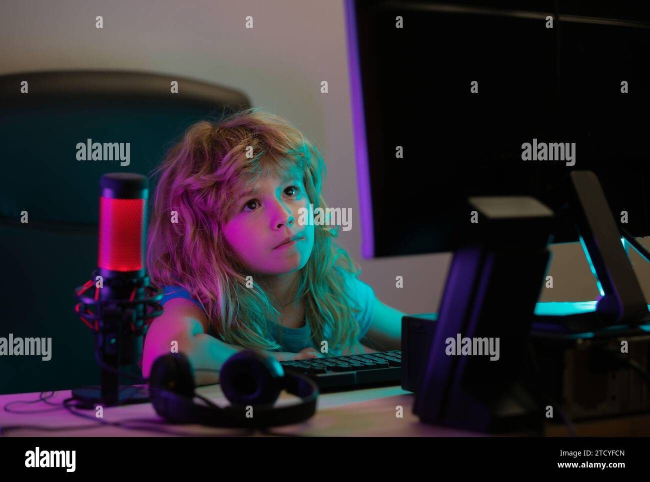 Little child blogger. Kid Boy recording a podcast on computer. School ...