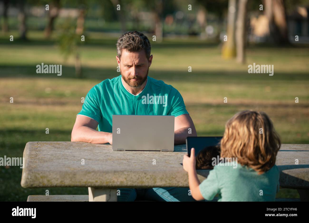 Son with daddy learning lesson. Blogging. Family education Concept ...