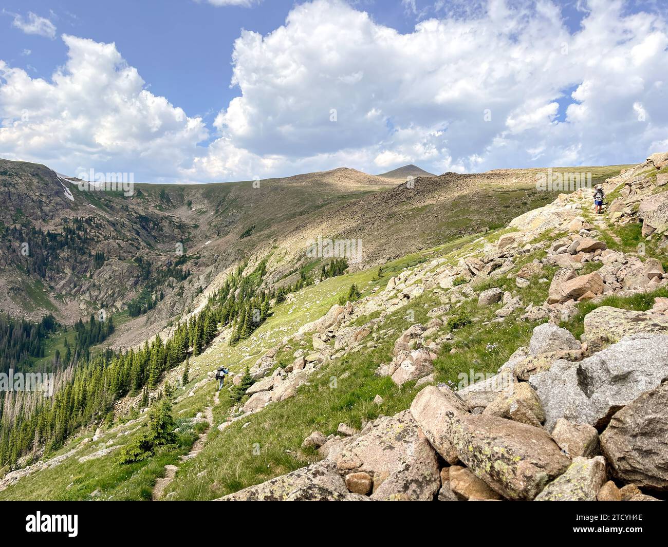 Hikers ascend the North Inlet Trail, embracing the vast alpine beauty ...