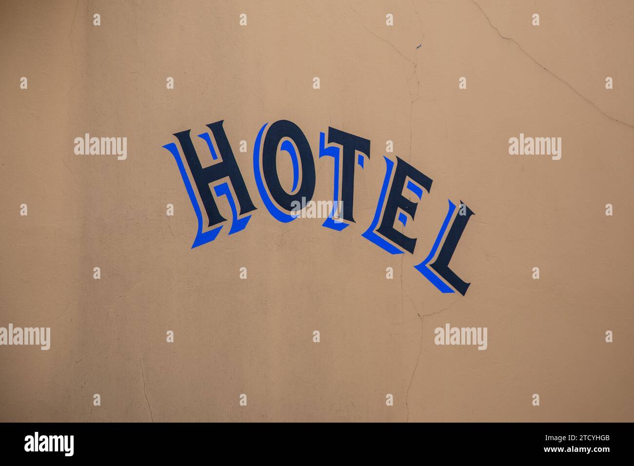 Hotel blue sign retro text vintage in wall building facade signage in ...