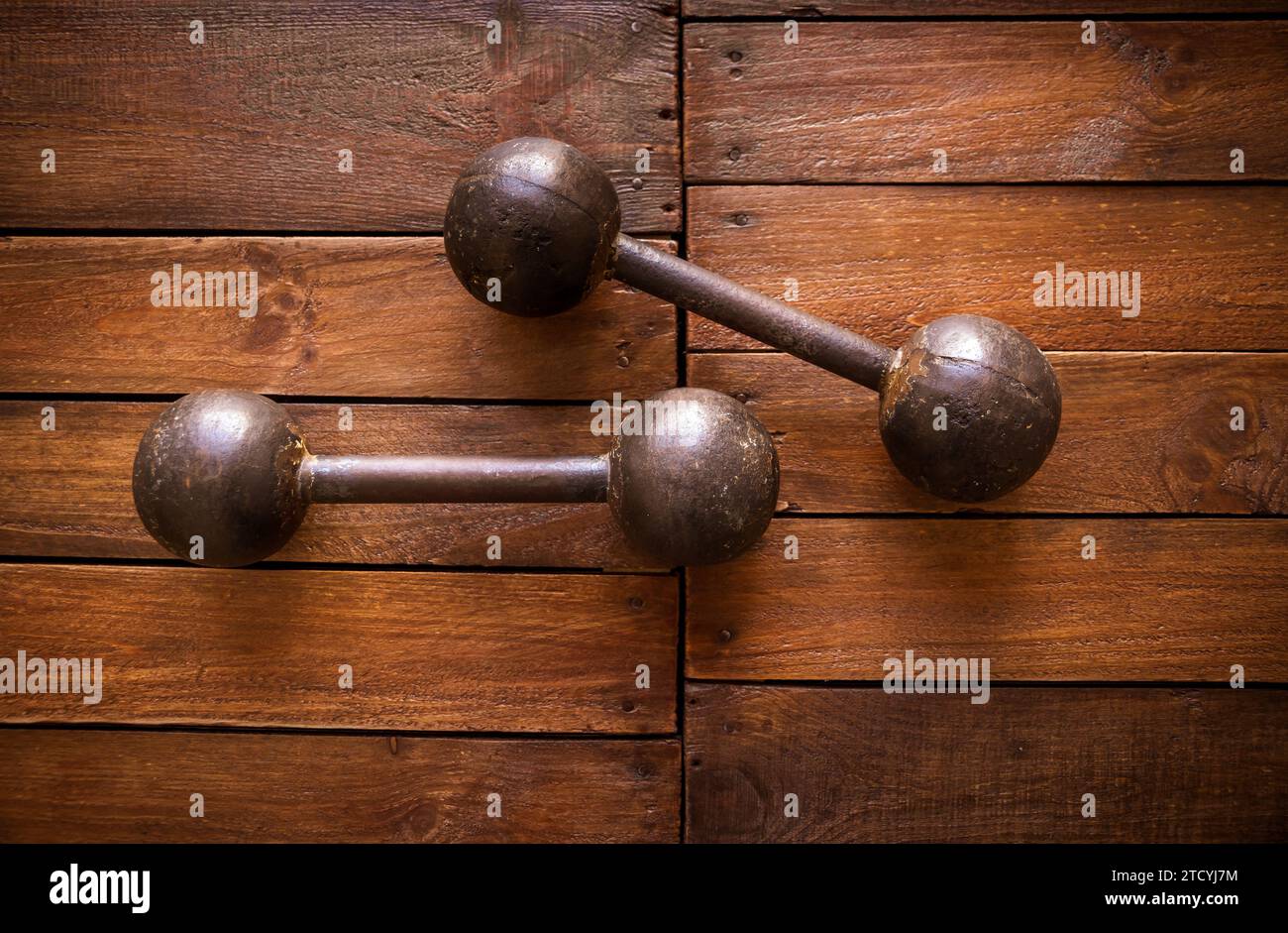Old rusty dumbbells on rustic wood board background texture Stock Photo ...