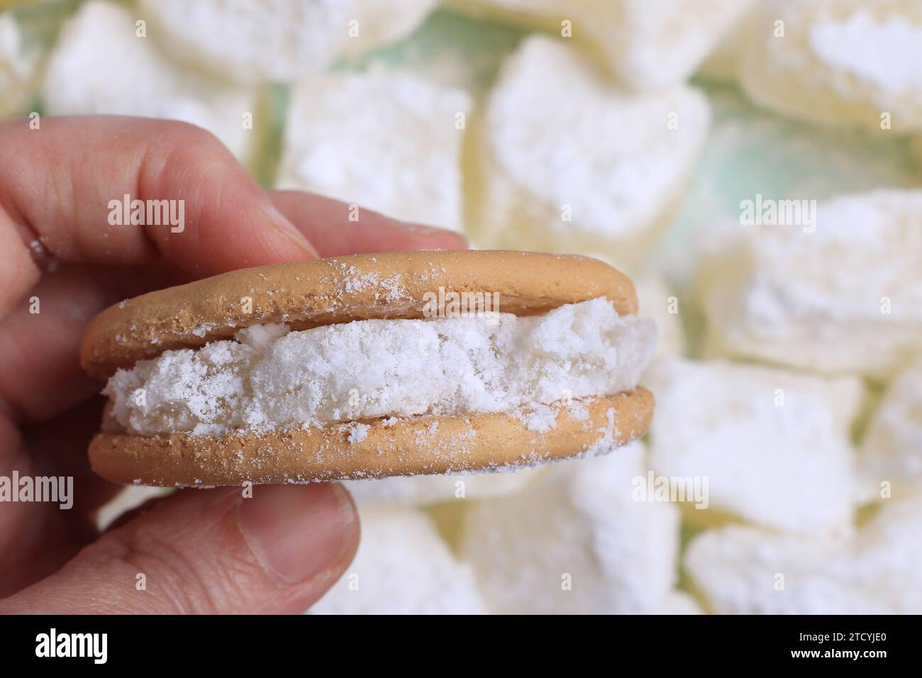 A biscuit filled with Turkish delight on white Stock Photo - Alamy