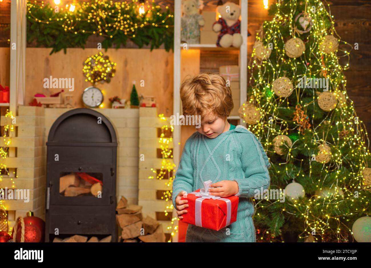 Winter delivery service for kids. Happy child with Christmas gift box ...