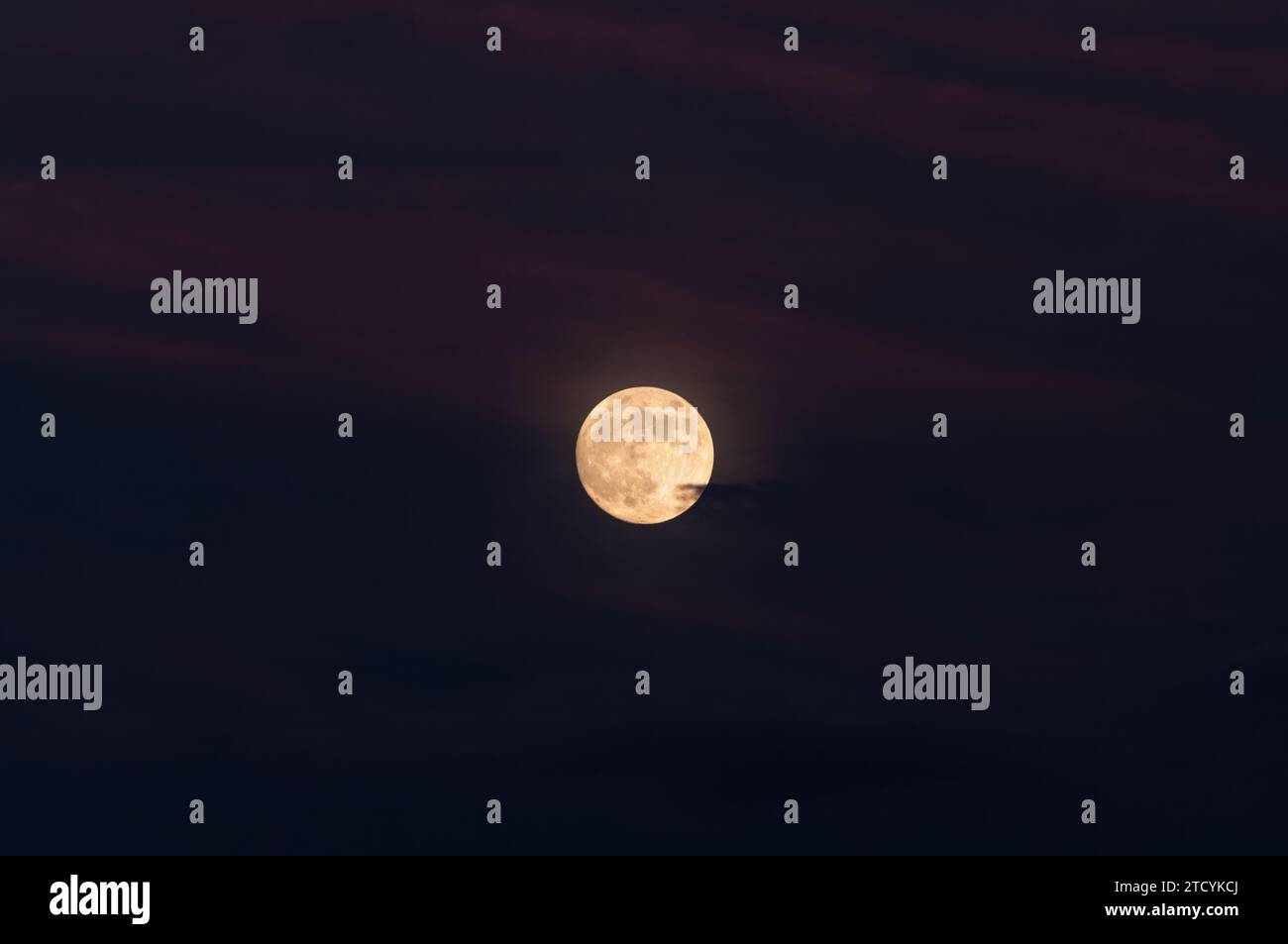 Beautiful full moon rising over the Mojave Desert shown against a ...