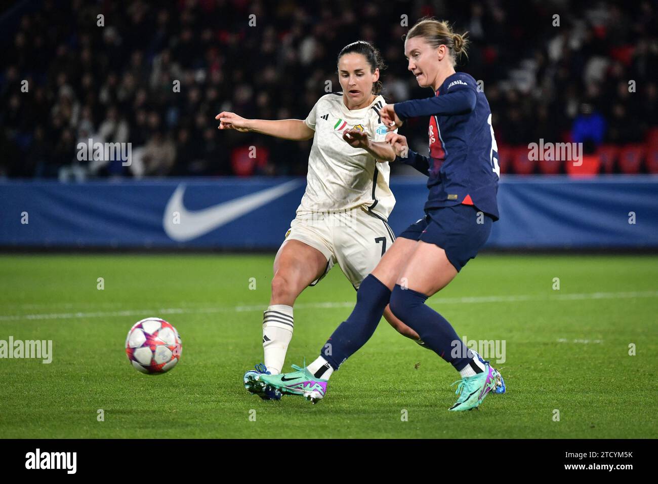 Paris Saint-Germain's defender Clare Hunt (R) kicks the ball during the ...