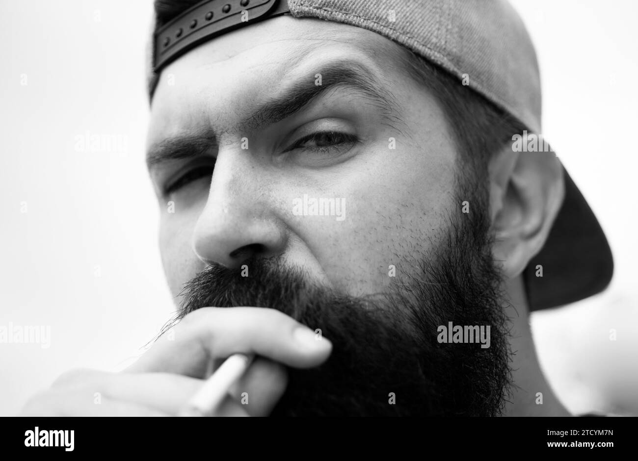 Closeup portrait of man man smoking cigarette. Handsome guy smoking ...