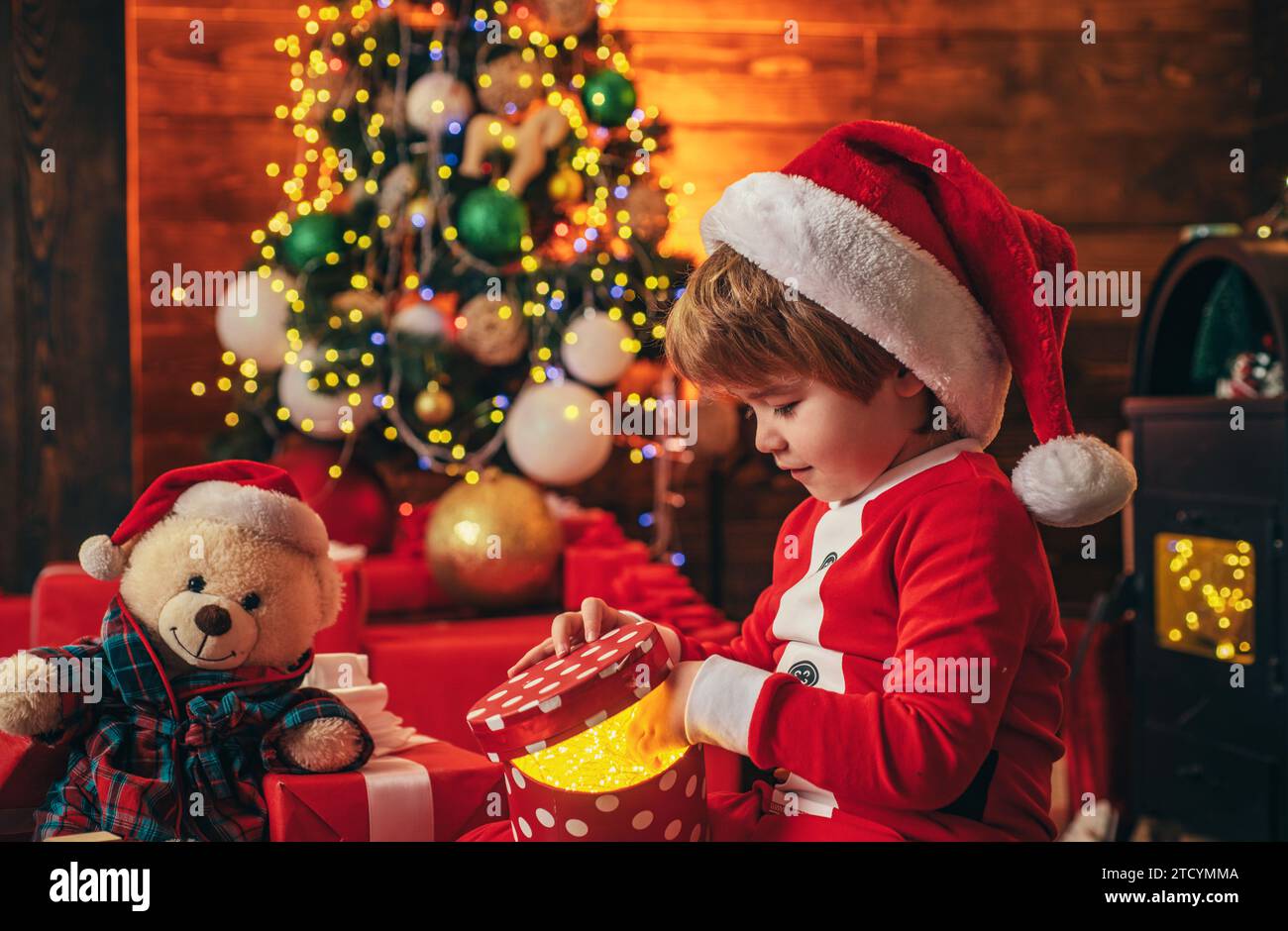 Boy child play christmas decorations. Merry and bright christmas ...