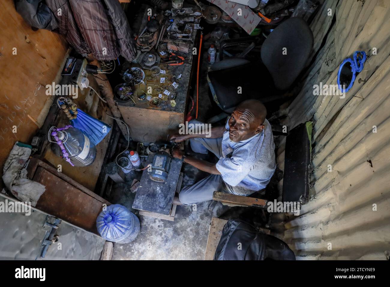Samwel Mwangi making jewelries at his shop in Kibera Slum on October 25 ...