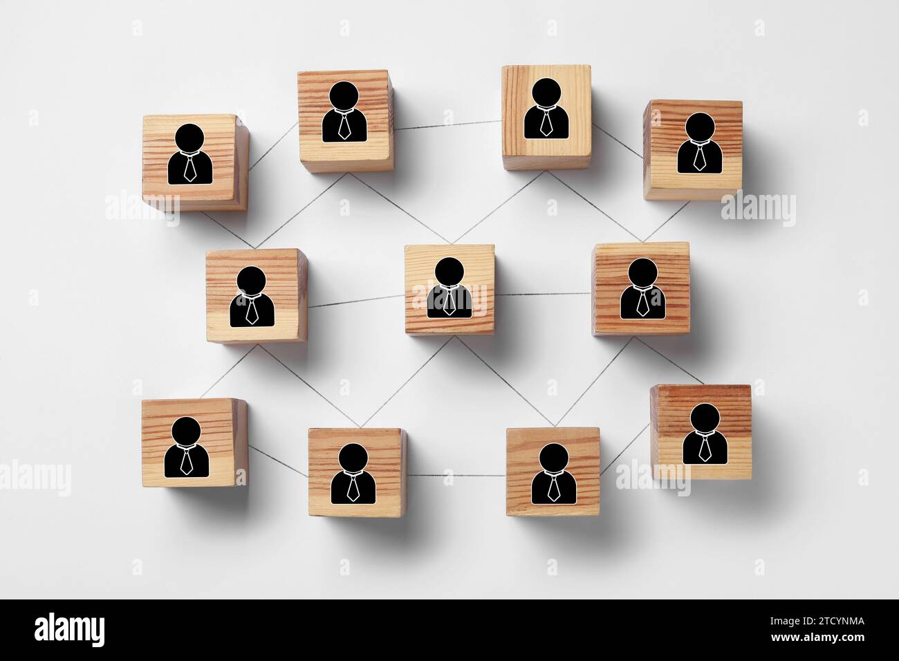 Teamwork. Wooden cubes with human icons linked together symbolizing ...