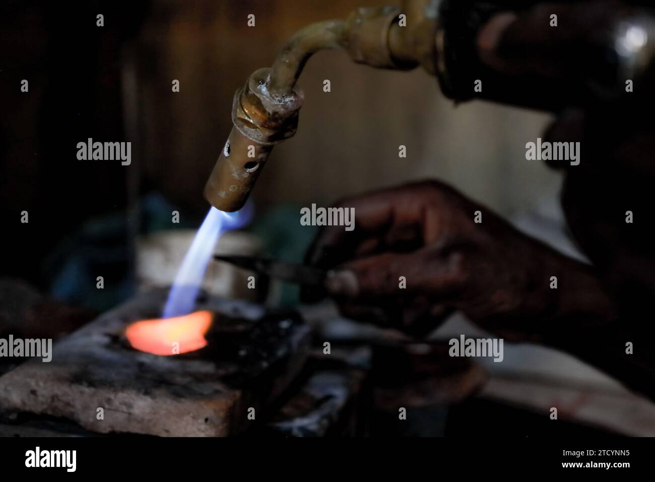 Samwel Mwangi makes jewelries at his shop in Kibera Slum on October 25, 2023 in Nairobi, Kenya ...