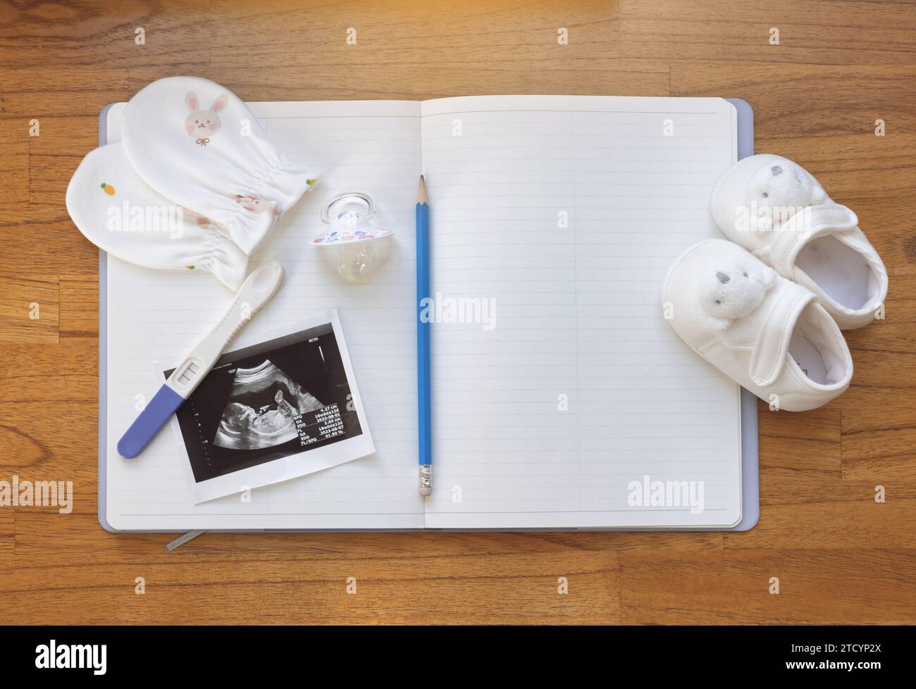 Notes and baby items, text space, planning Stock Photo - Alamy