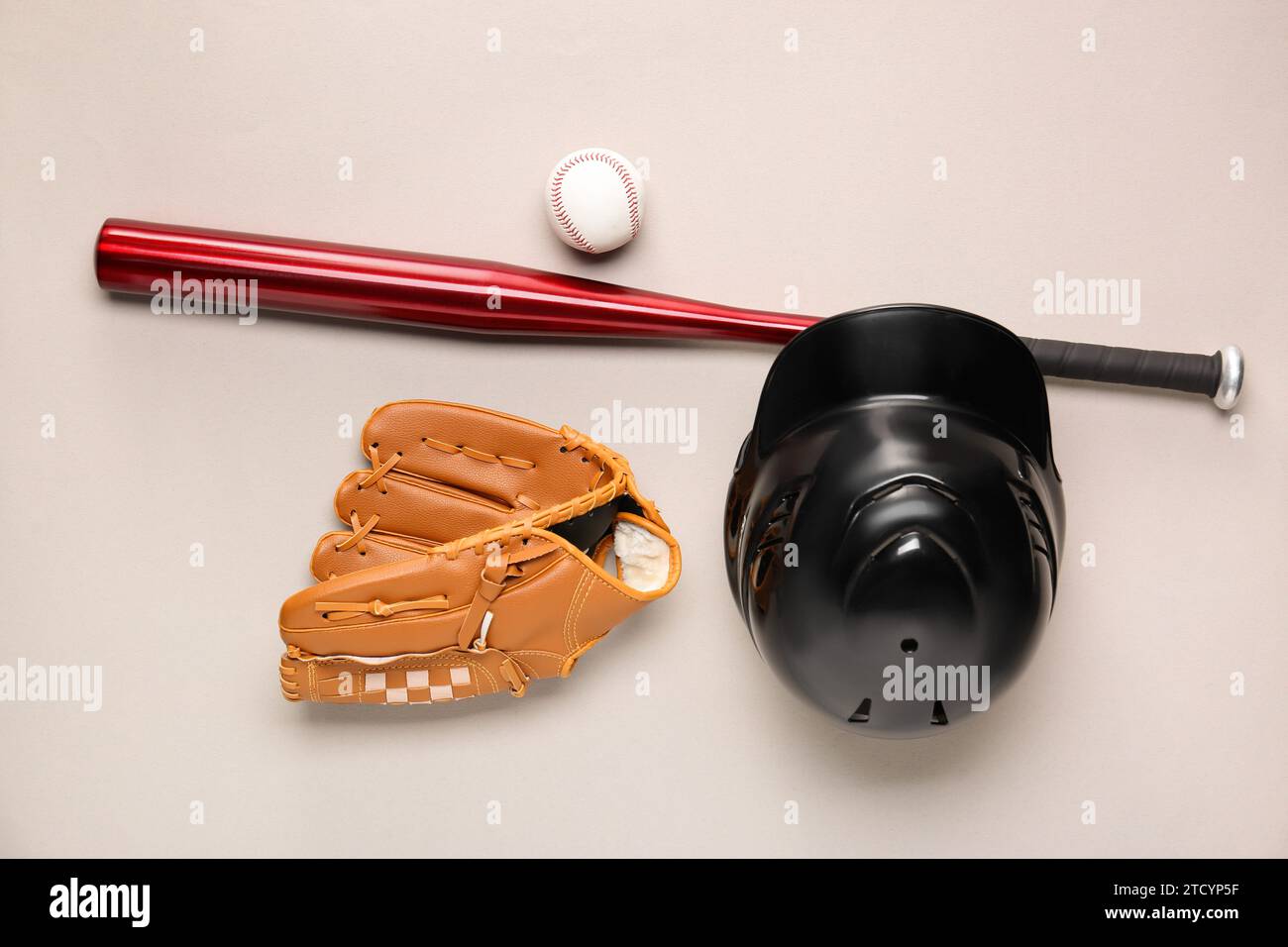 Baseball glove, bat, ball and batting helmet on light grey background ...