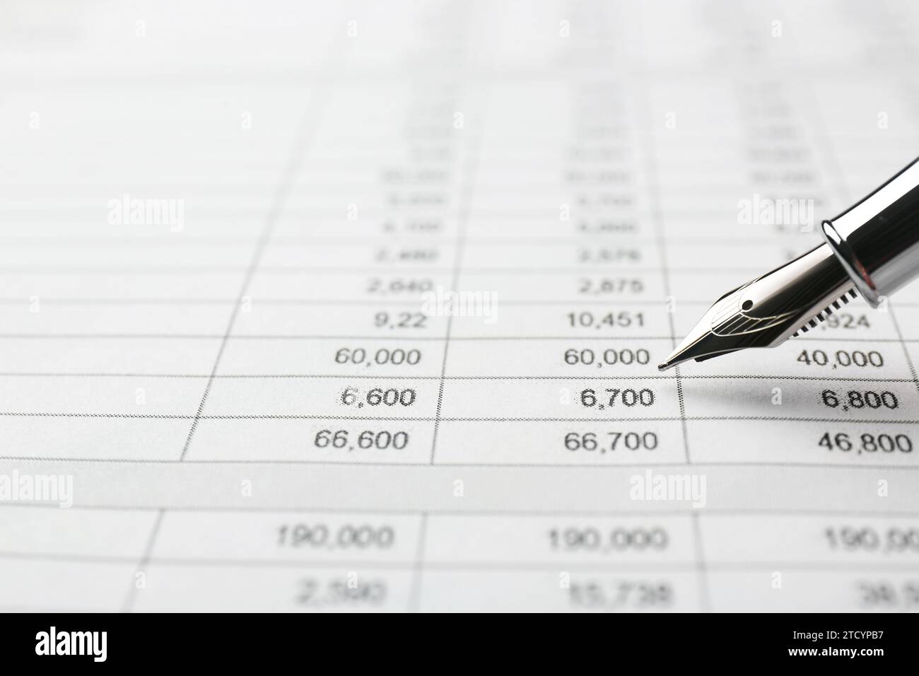 Fountain pen and accounting document with data, closeup. Space for text ...