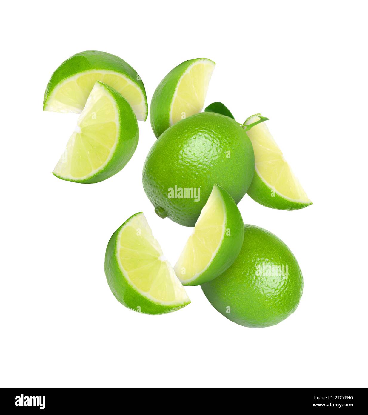 Fresh ripe limes falling on white background Stock Photo - Alamy