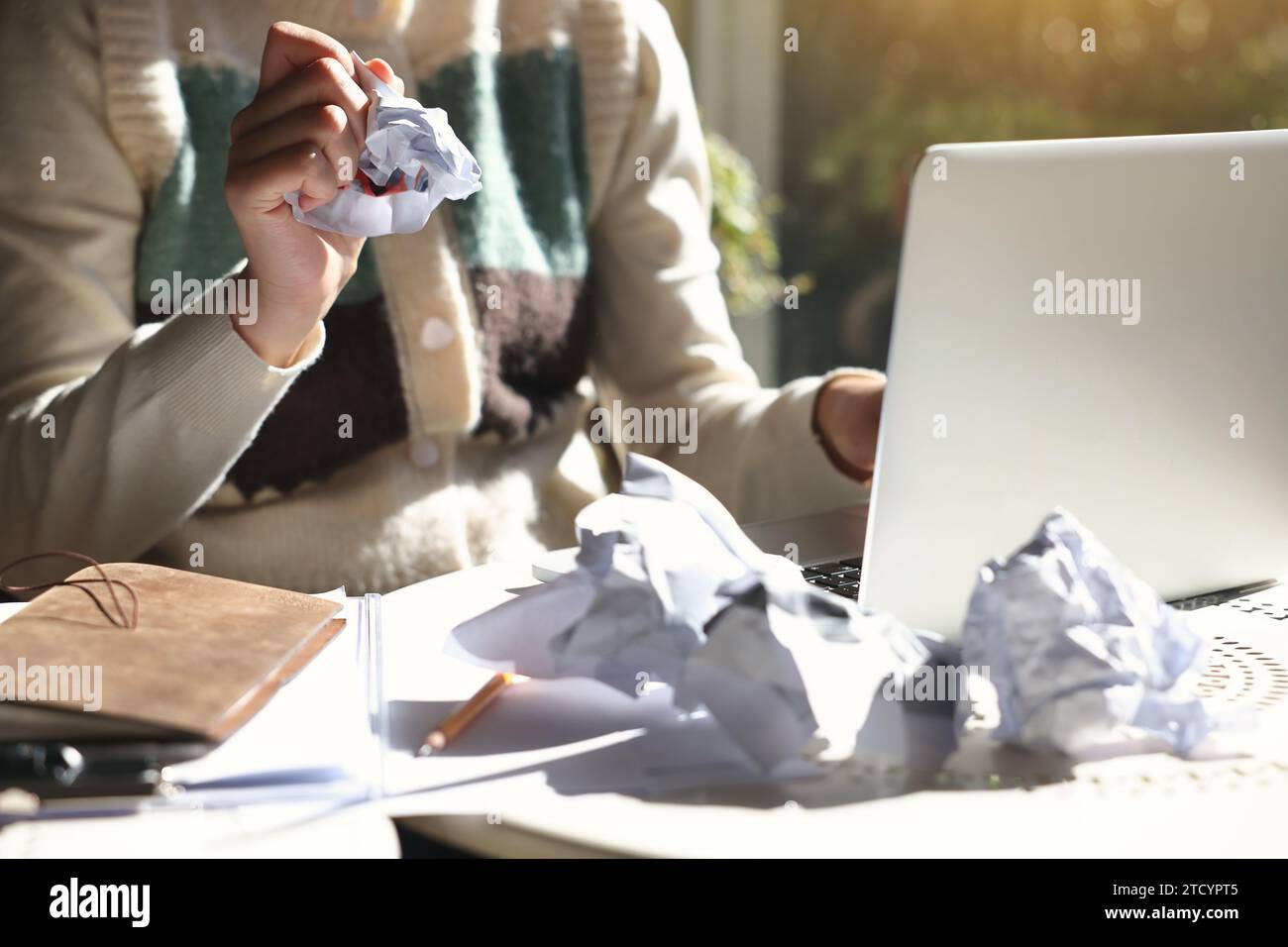 Woman throwing crumpled paper hi-res stock photography and images - Alamy