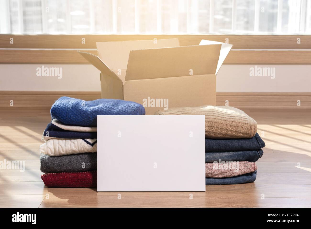 The scene of taking pictures to sell second-hand clothes. A white board ...