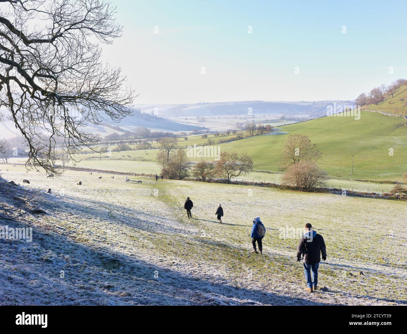 Group of four ramblers descend Hitter hill in the Peak District ...