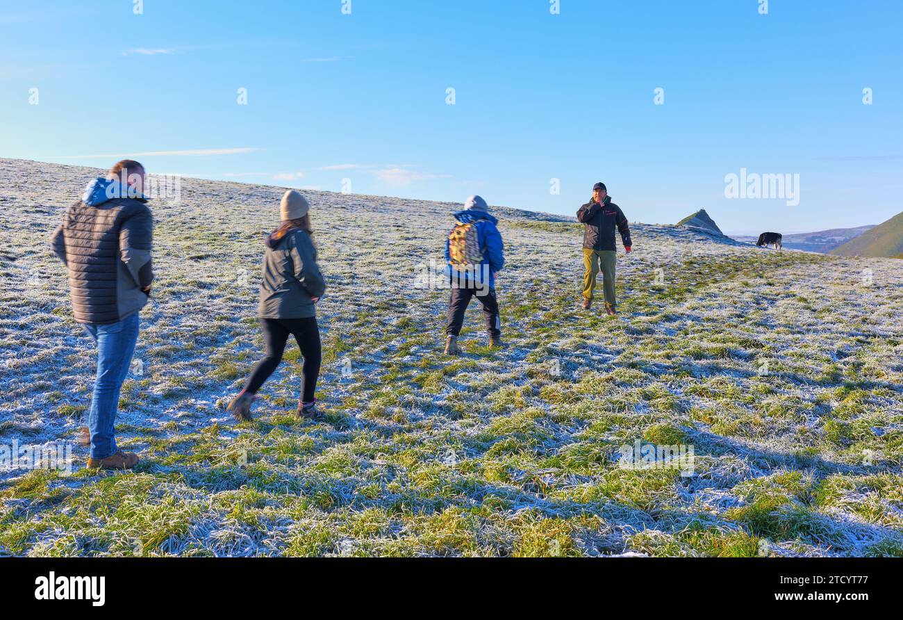 Group of four ramblers ascend a slope towards Parkhouse Hill and Chrome ...