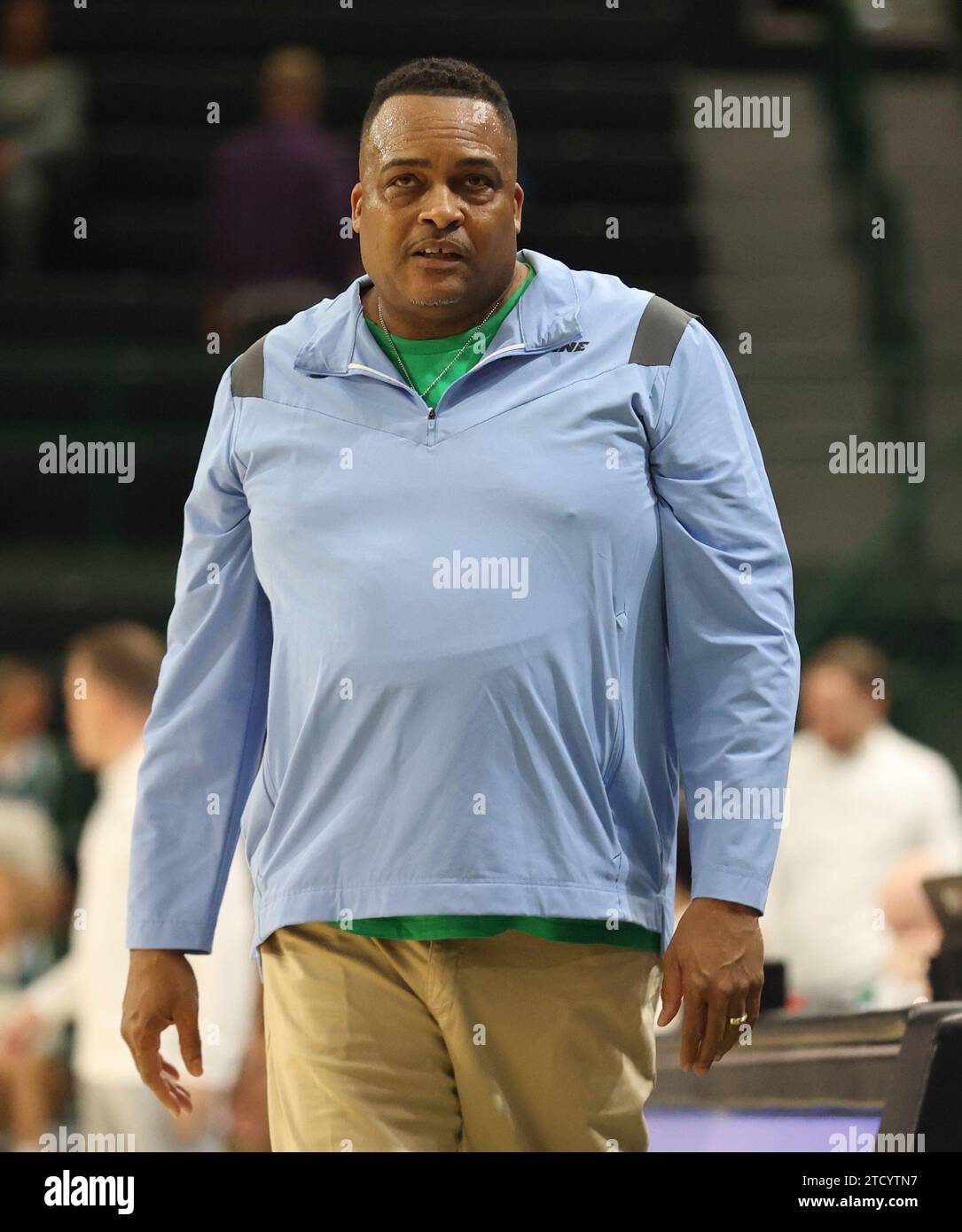 Tulane Green Wave head coach Ron Hunter talks to his assistant coaches ...