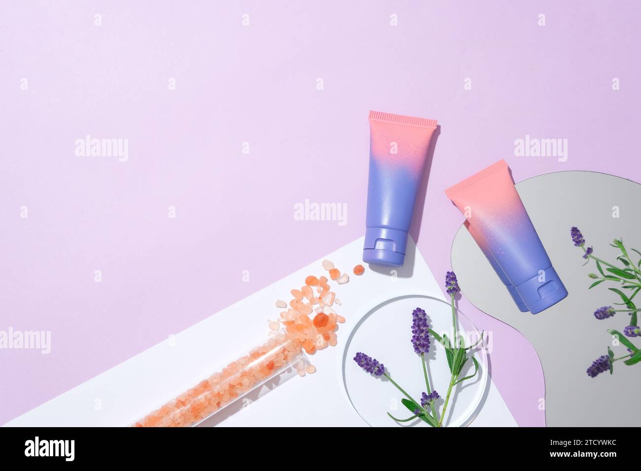 Pink salt pours from a test tube, lavender in a petri dish, and ...