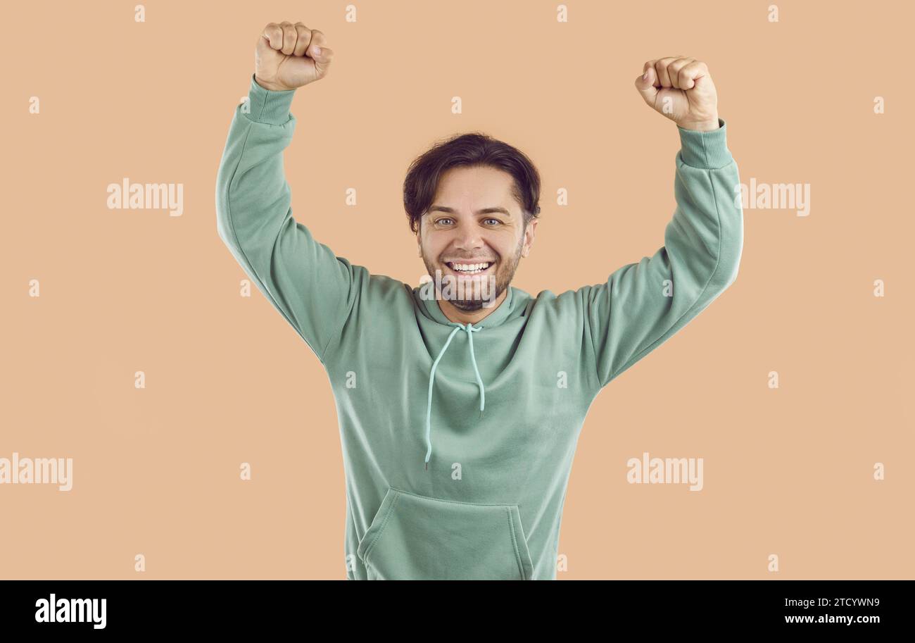 Beard young man celebrating success hi-res stock photography and images ...