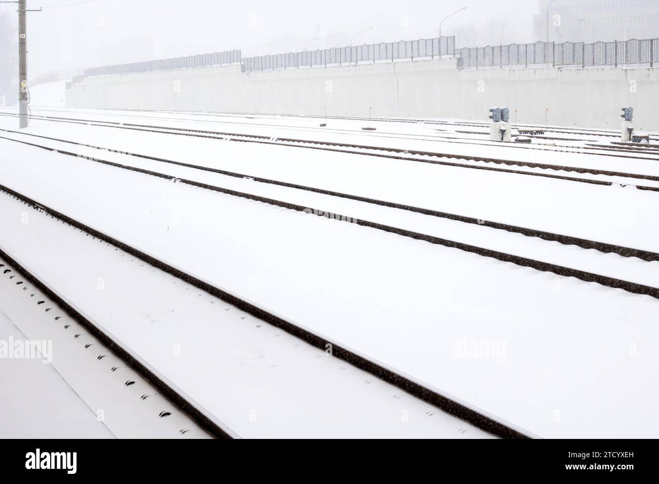 Train rails in the snow in a snowstorm Stock Photo - Alamy