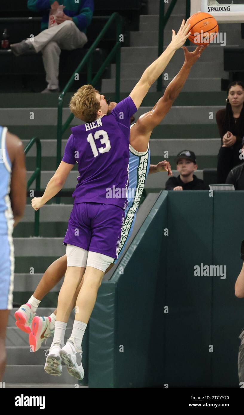 Furman Paladins forward Garrett Hien (13) tries to block Tulane Green ...