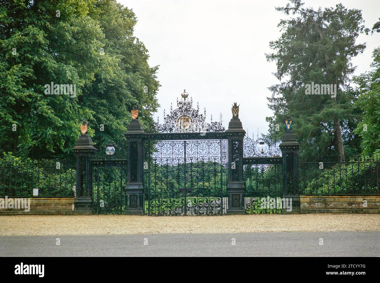 Ornate metal gateway entrance to the Royal estate house and gardens ...