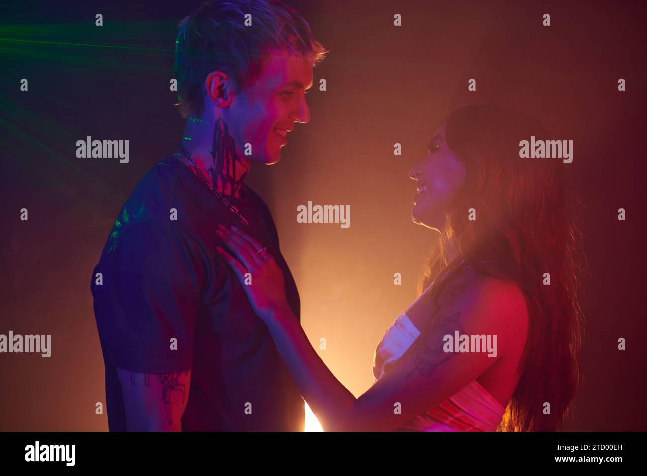 Young couple in love dancing at night party Stock Photo - Alamy