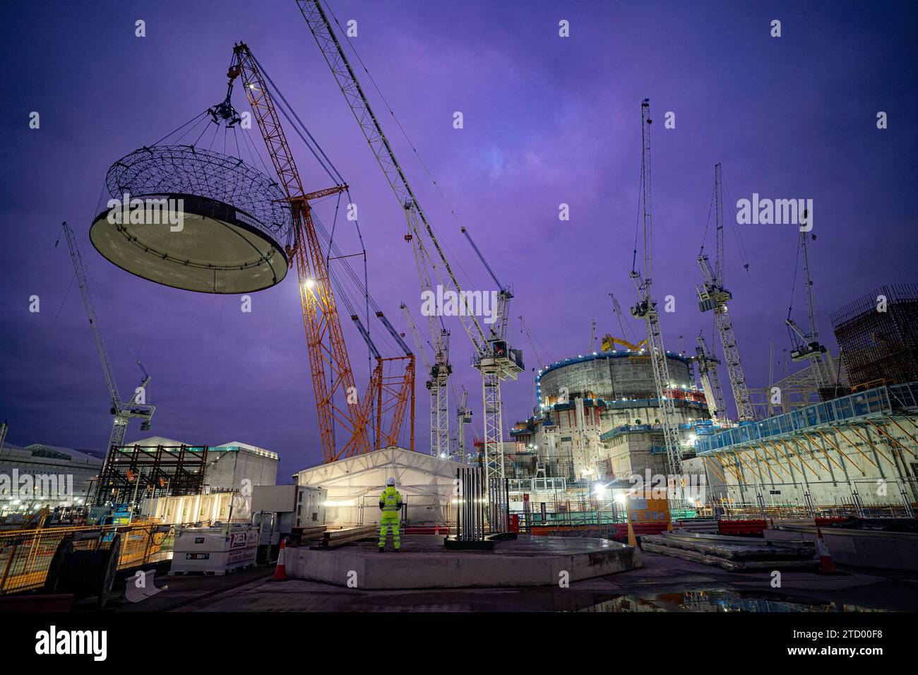 Engineering teams use the world's largest crane - Big Carl - to lift a 245-tonne steel dome onto ...