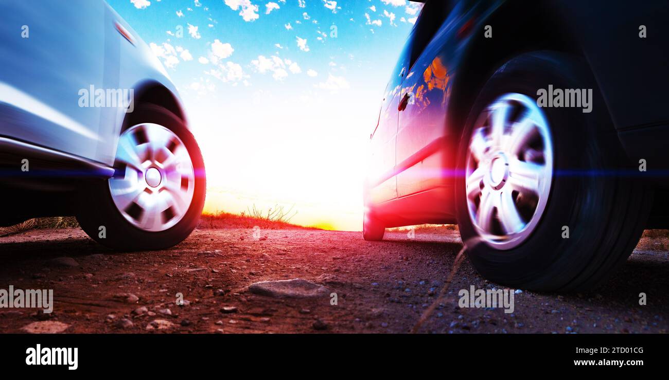 Closed image of car wheels and tires on the ground and sunset sky.Car ...